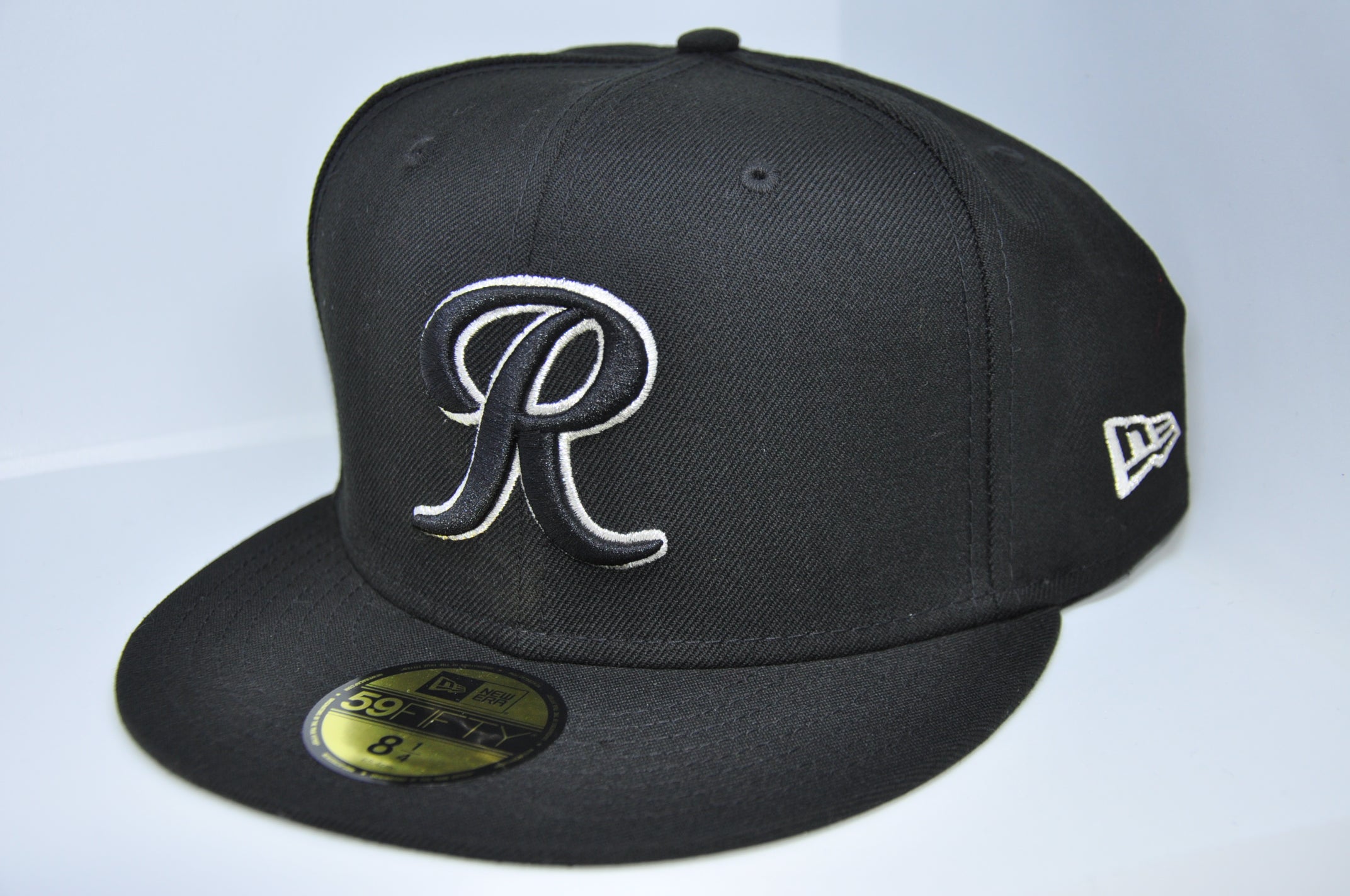 Tacoma Rainiers New Era All Black With Metallic Silver Around Letter R ...